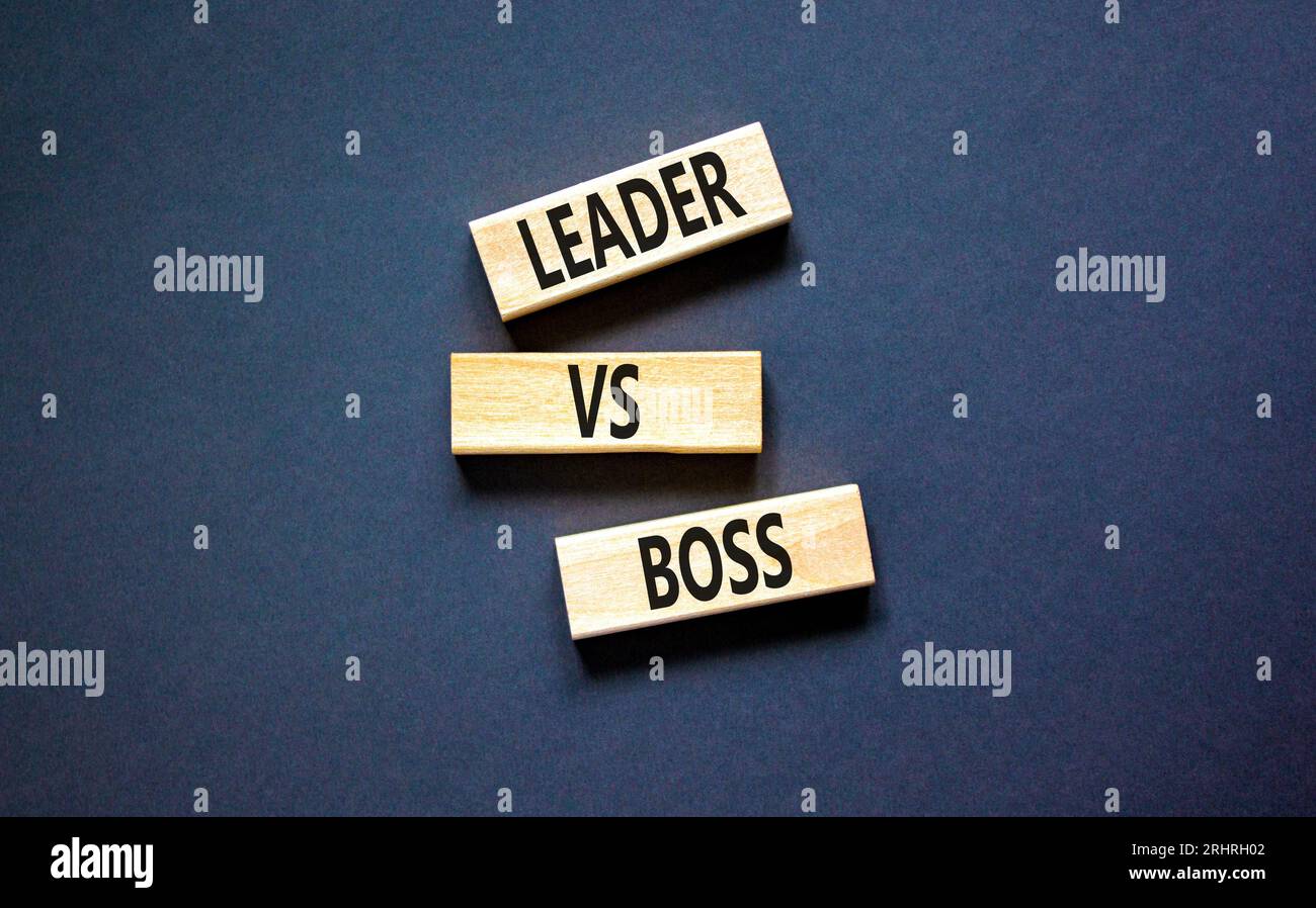 Boss vs leader symbol. Concept words Boss vs versus leader on wooden ...