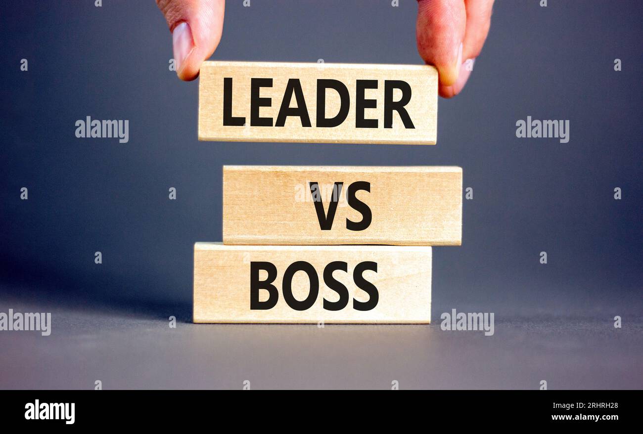Boss vs leader symbol. Concept words Boss vs versus leader on wooden ...