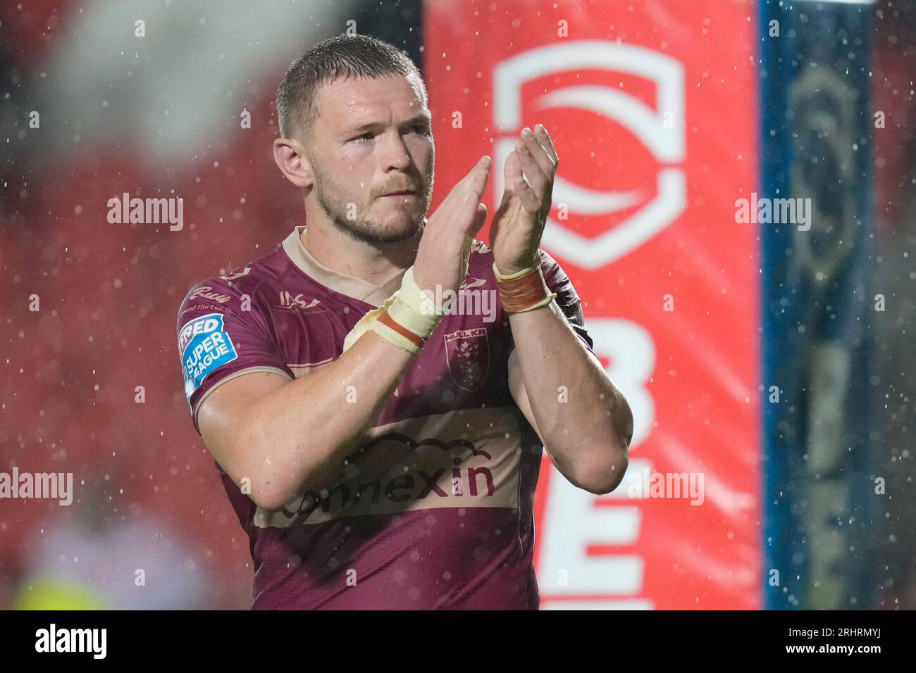St Helens, UK. 18th Aug, 2023. James Batchelor #16 of Hull KR salutes ...