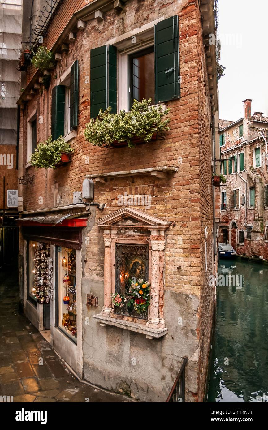 Urban streetscape building with shrine window, Venice Italy Stock Photo ...