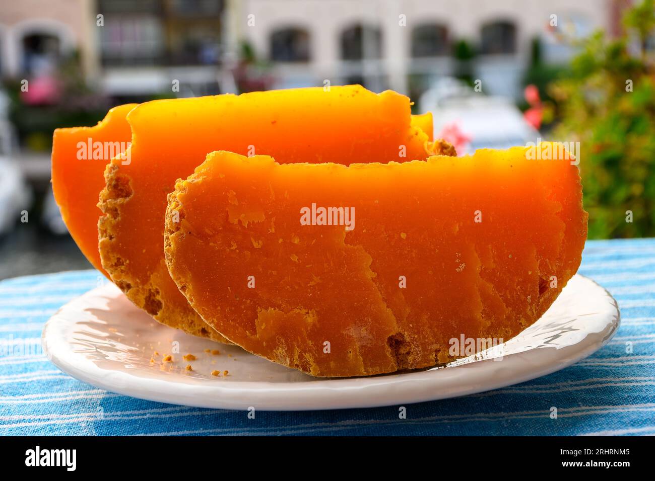 Pieces of native French aged cheese Mimolette, produced in Lille with ...