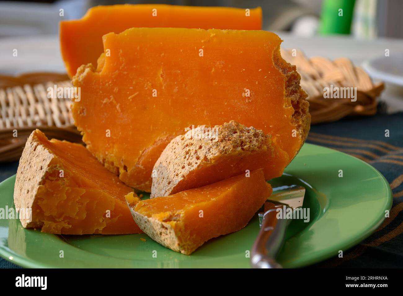 Pieces of native French aged cheese Mimolette, produced in Lille with ...