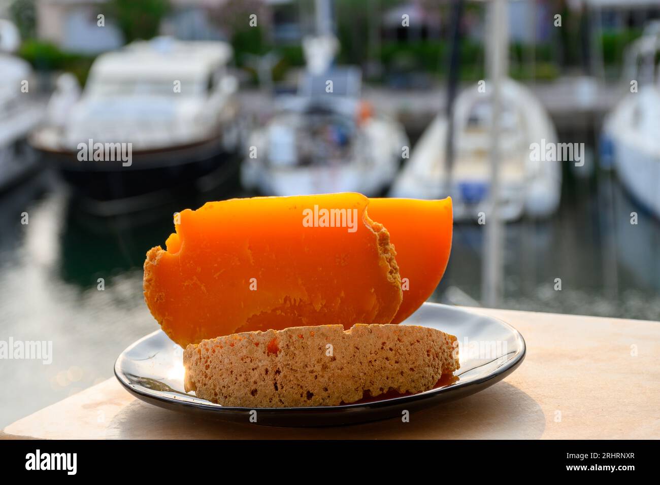 Pieces of native French aged cheese Mimolette, produced in Lille with ...