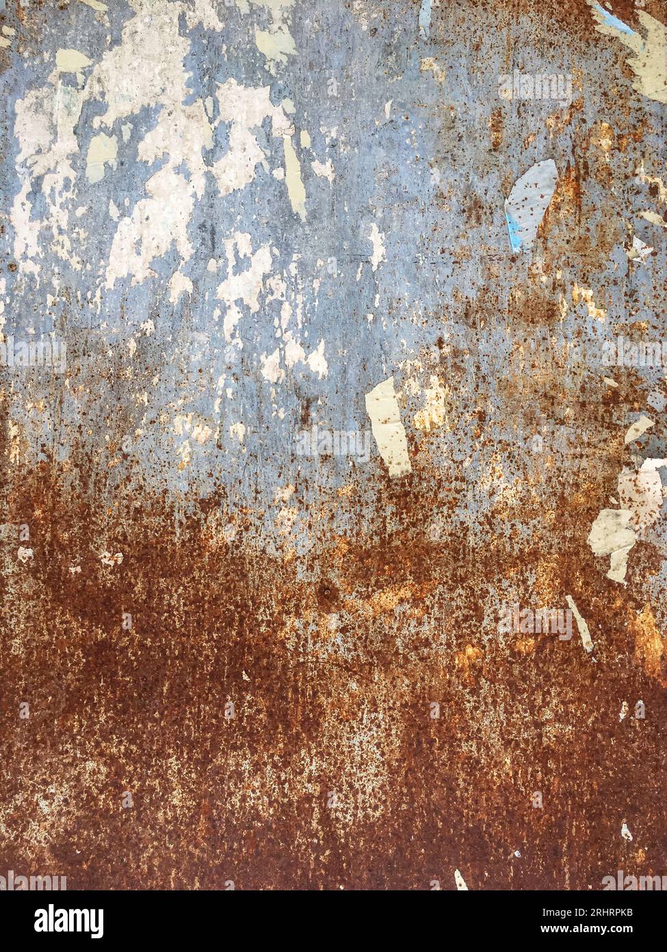 Rusty metal background with torn poster pieces. Ideal for concepts and ...