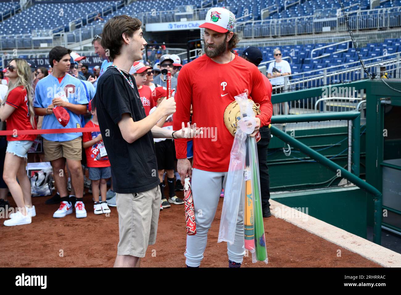 Philadelphia Phillies' Bryce Harper, right, gets interviewed before a ...