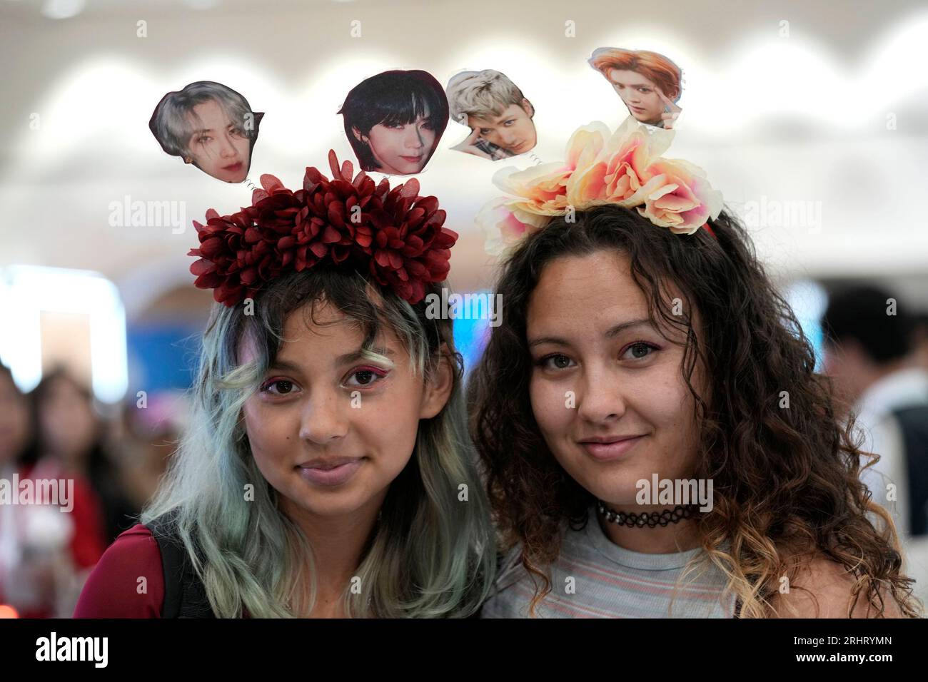 Zana Schreier, left, and Ashley Ward, of San Diego, wear headbands with ...