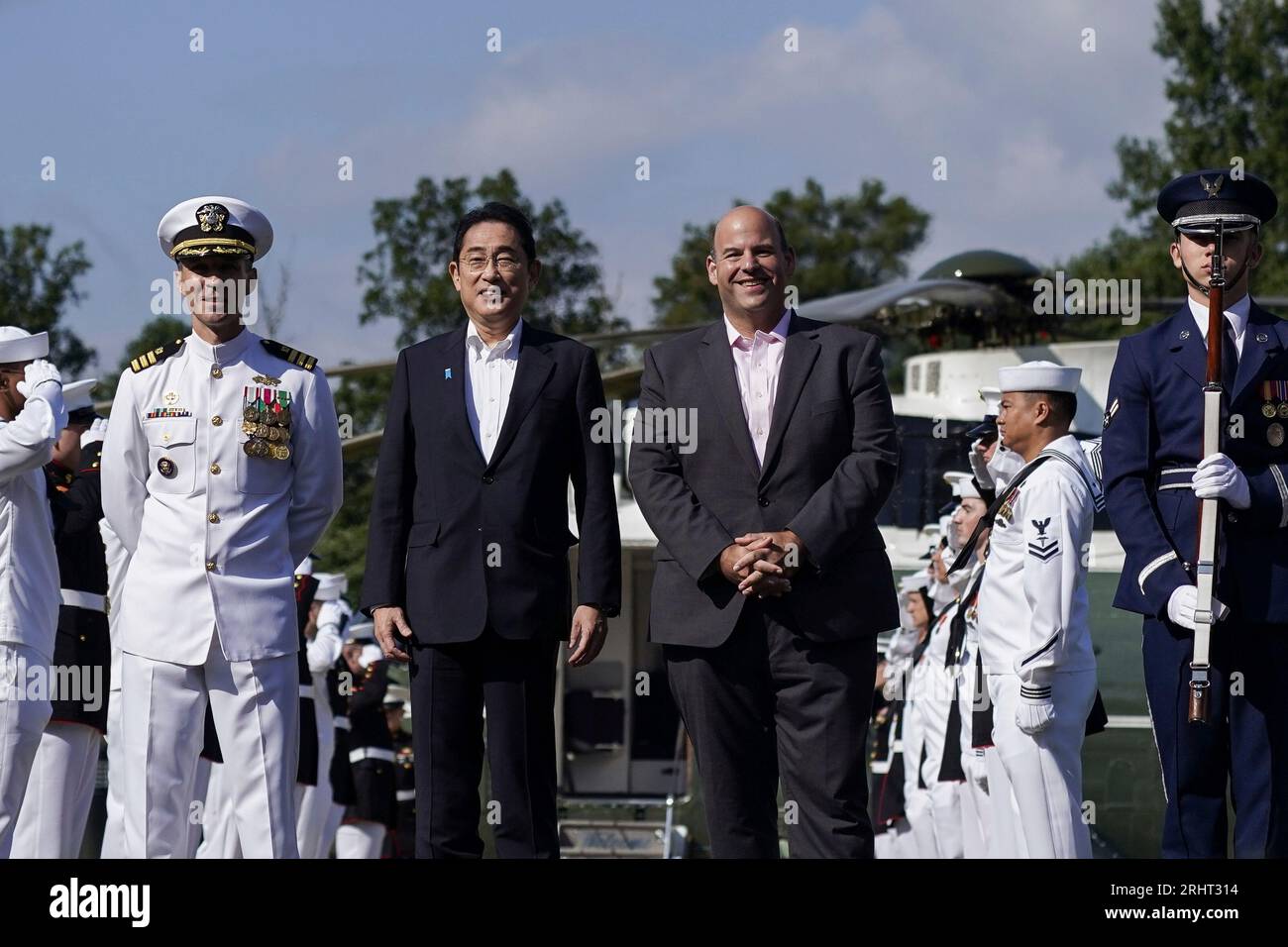 Japanese Prime Minister Fumio Kishida poses for a photo with Ethan ...