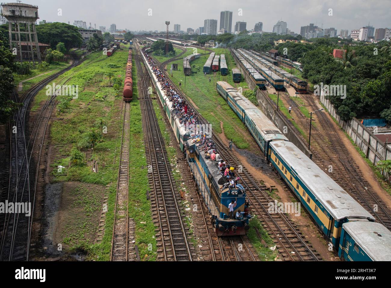 An overcrowded train leaves the Kamlapur Railway Station in Dhaka ahead ...