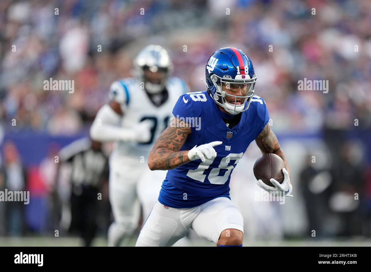 New York Giants' Isaiah Hodgins runs with the ball during the first ...