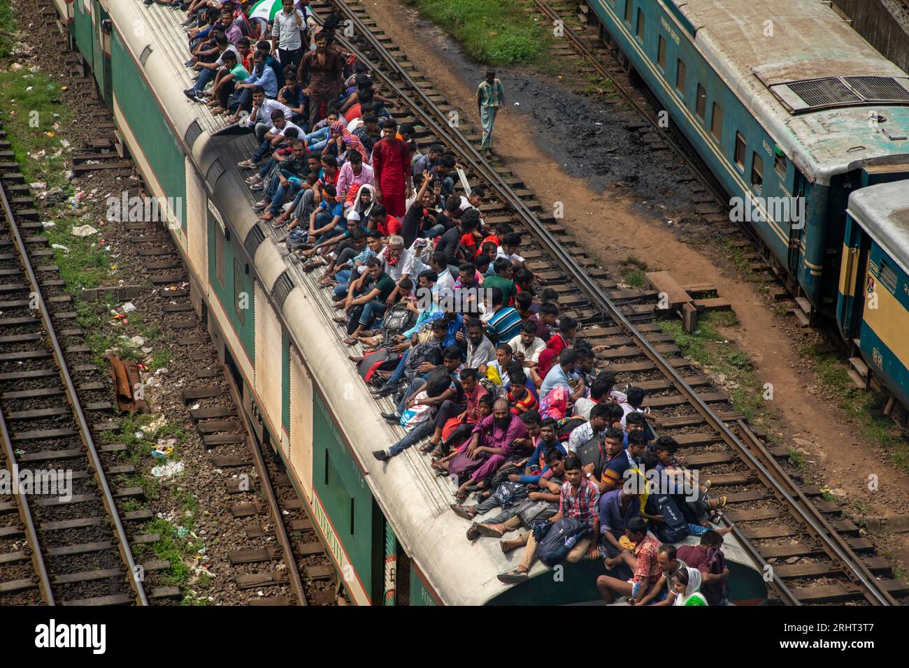 An overcrowded train leaves the Kamlapur Railway Station in Dhaka ahead ...