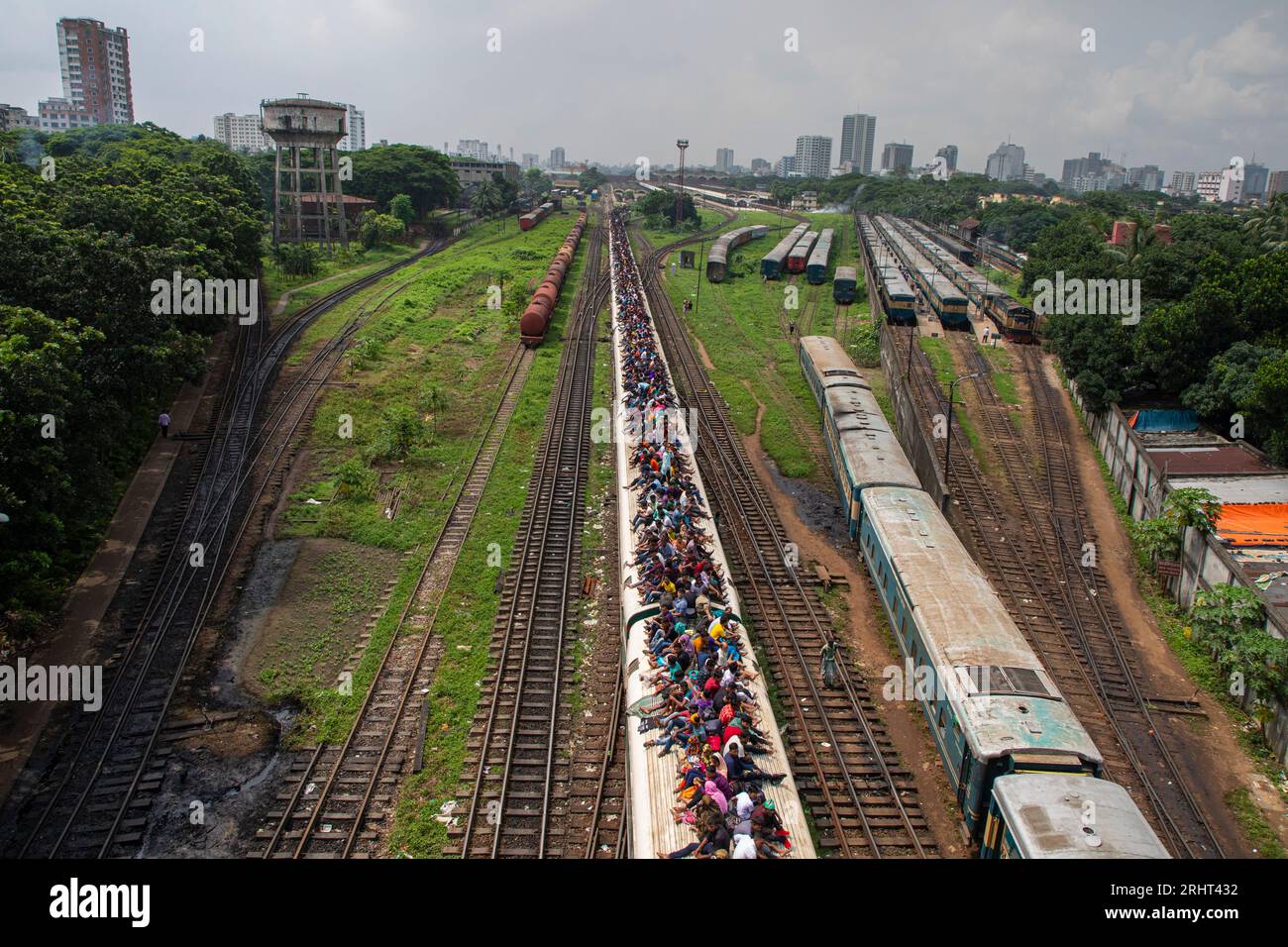 An overcrowded train leaves the Kamlapur Railway Station in Dhaka ahead ...