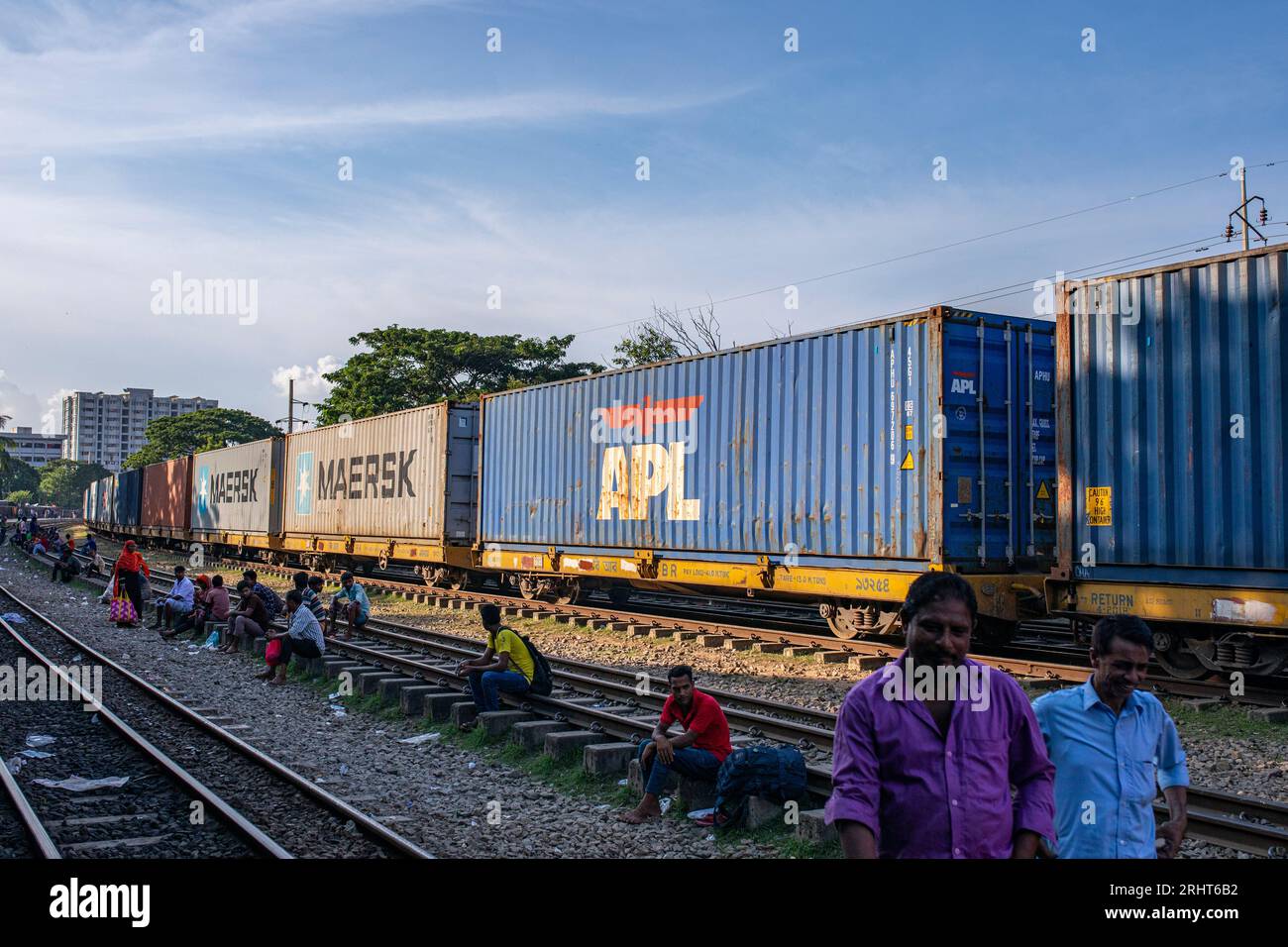 A shipping container trail cross the Airport Railway Station in Dhaka ...