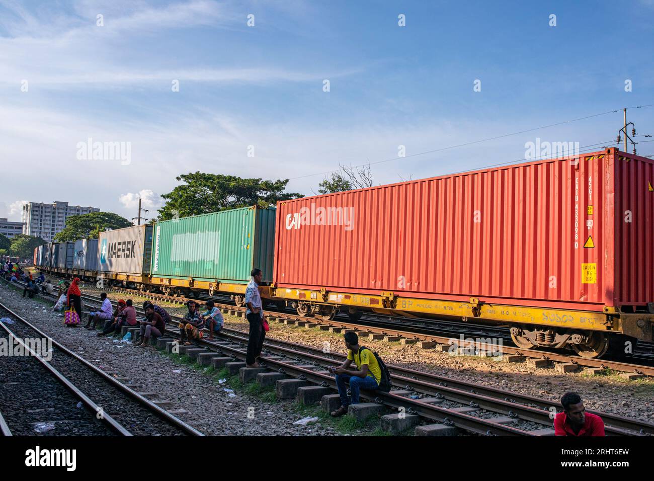A shipping container trail cross the Airport Railway Station in Dhaka ...