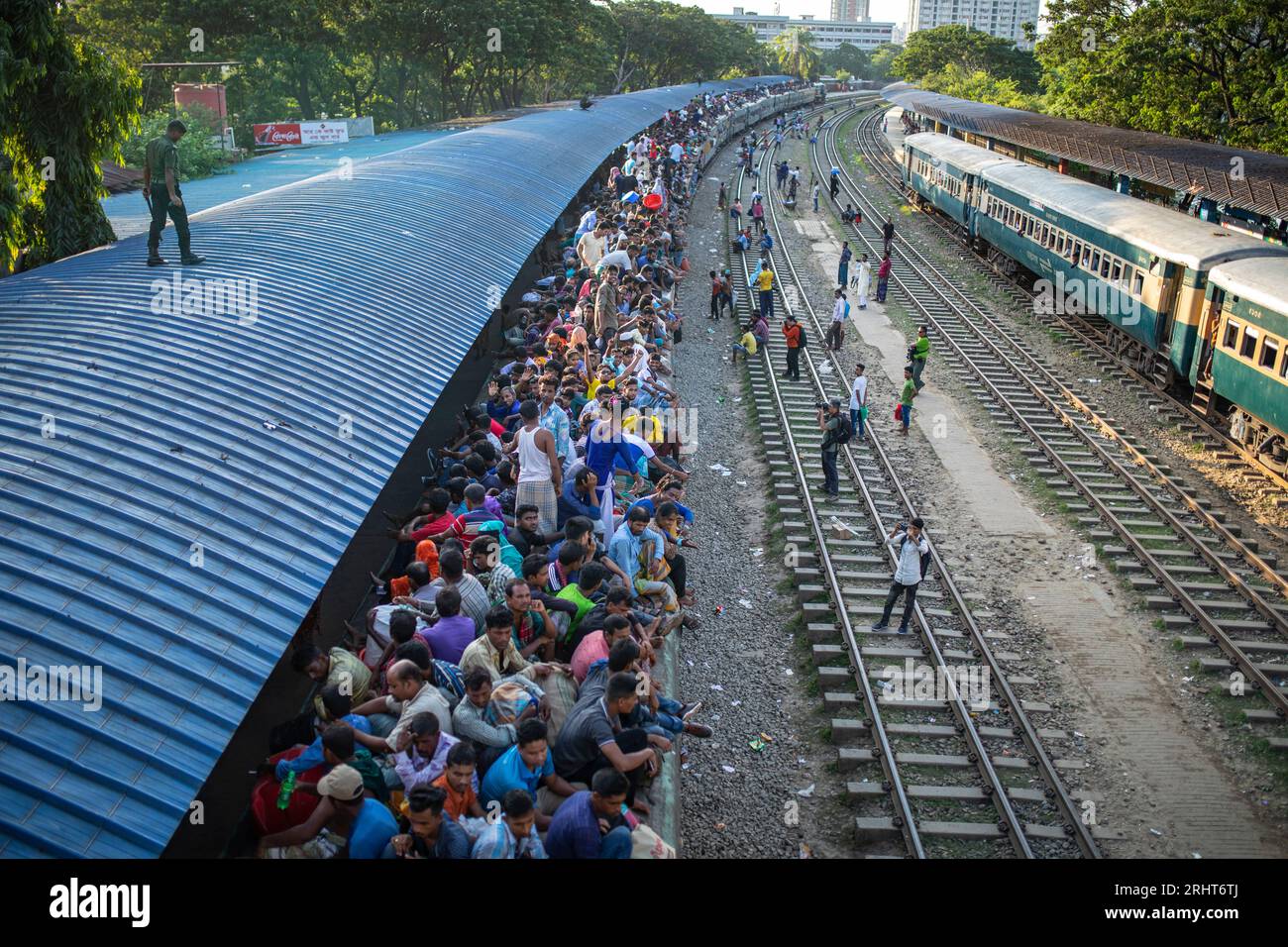 An overcrowded train leaves the Airport Railway Station in Dhaka ahead ...