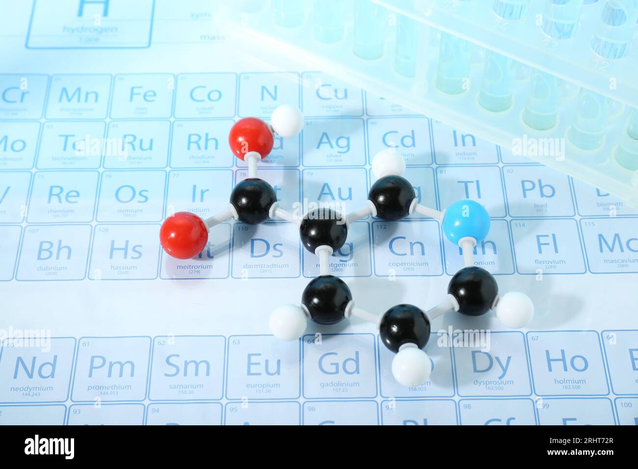 Molecular model and test tubes on periodic table Stock Photo - Alamy