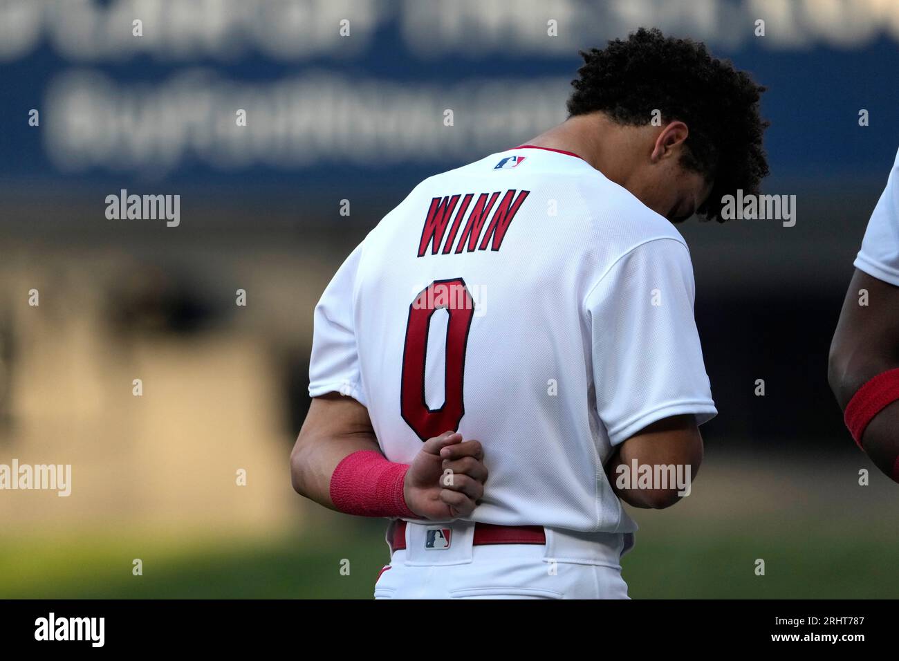 St. Louis Cardinals' Masyn Winn pauses for the national anthem before ...