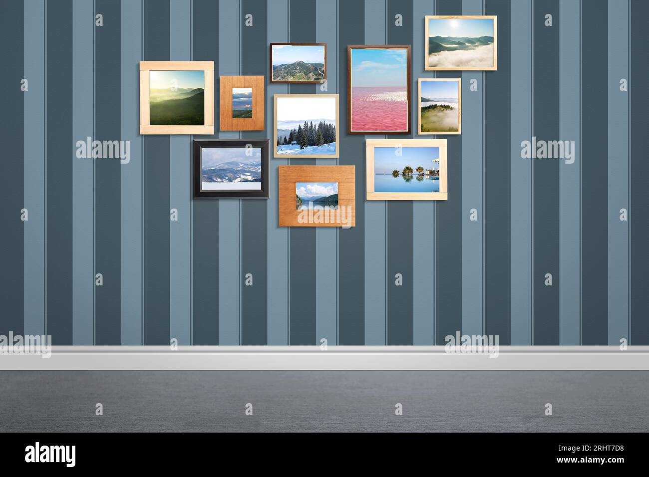 Many beautiful landscapes in frames on striped wall in room Stock Photo ...