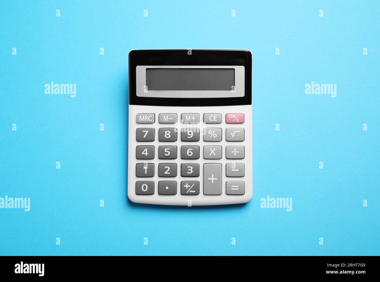 Calculator on light blue background, top view. Office equipment Stock ...