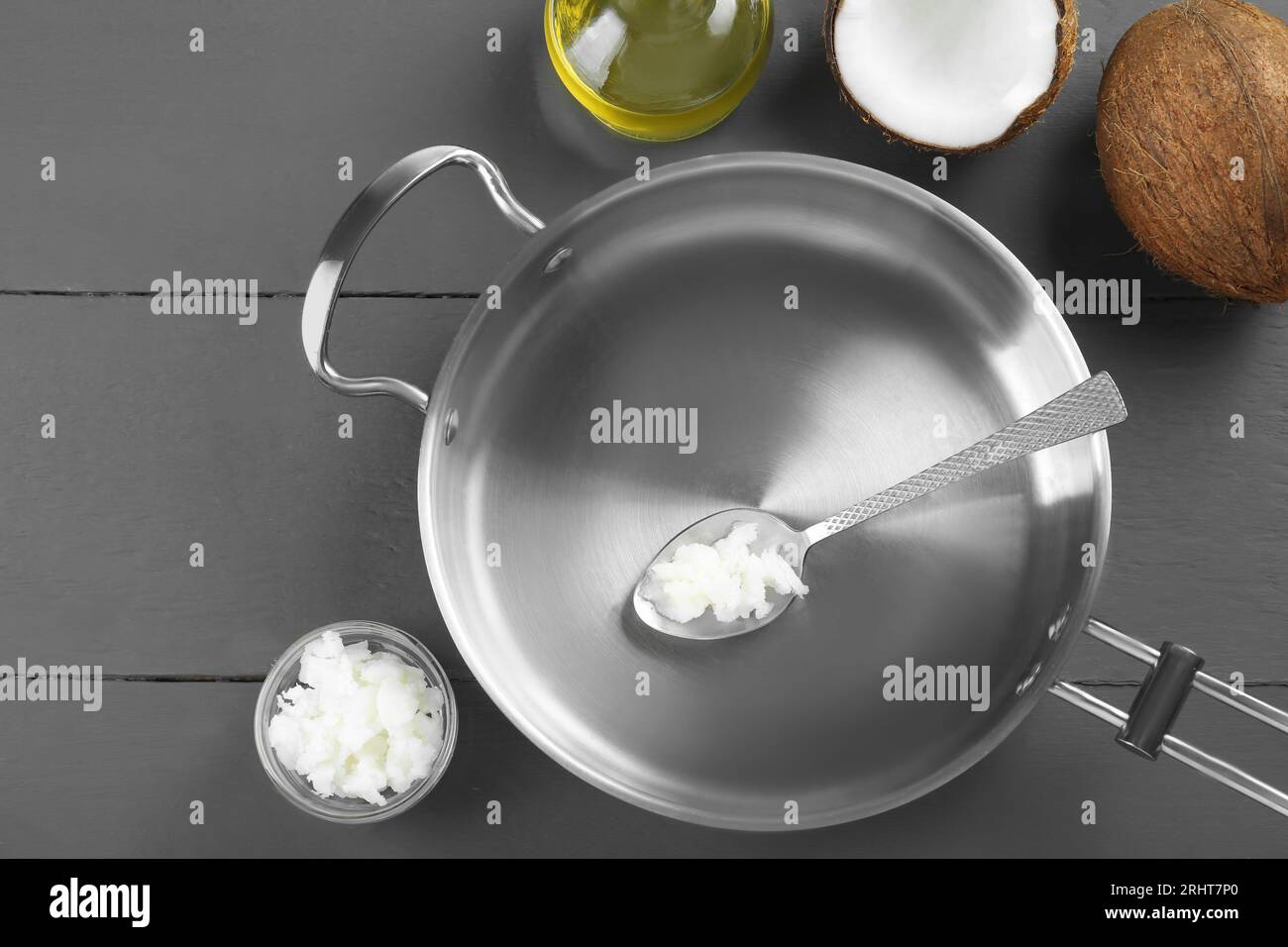 Flat lay composition with frying pan and organic coconut cooking oil on ...