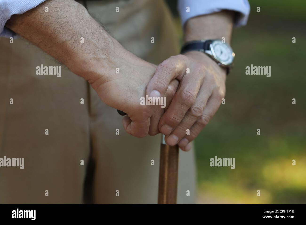 Senior man with walking cane outdoors, closeup Stock Photo - Alamy