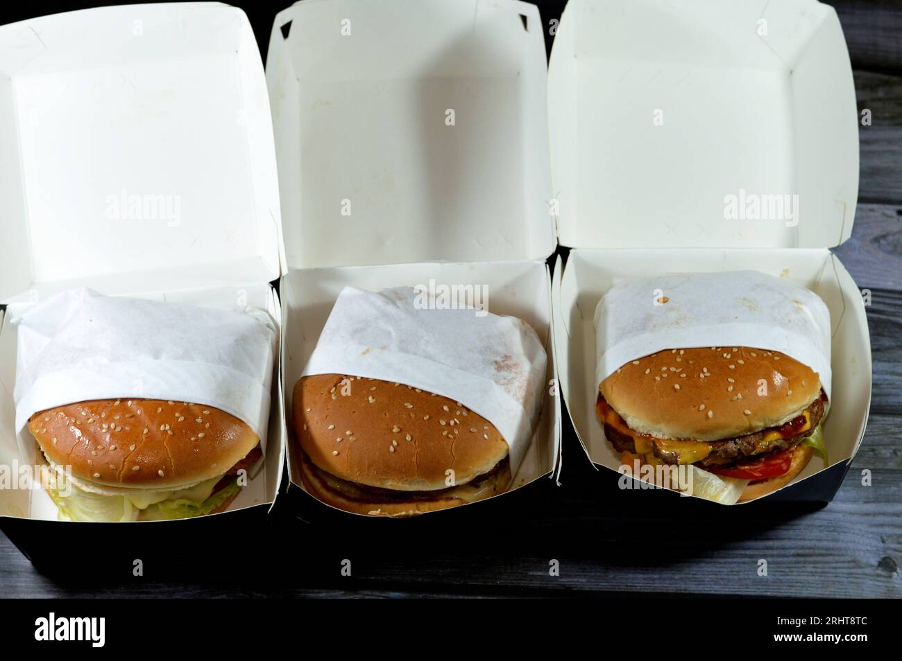 Pile of sesame buns of fried breaded chicken fillet patties, crisp ...