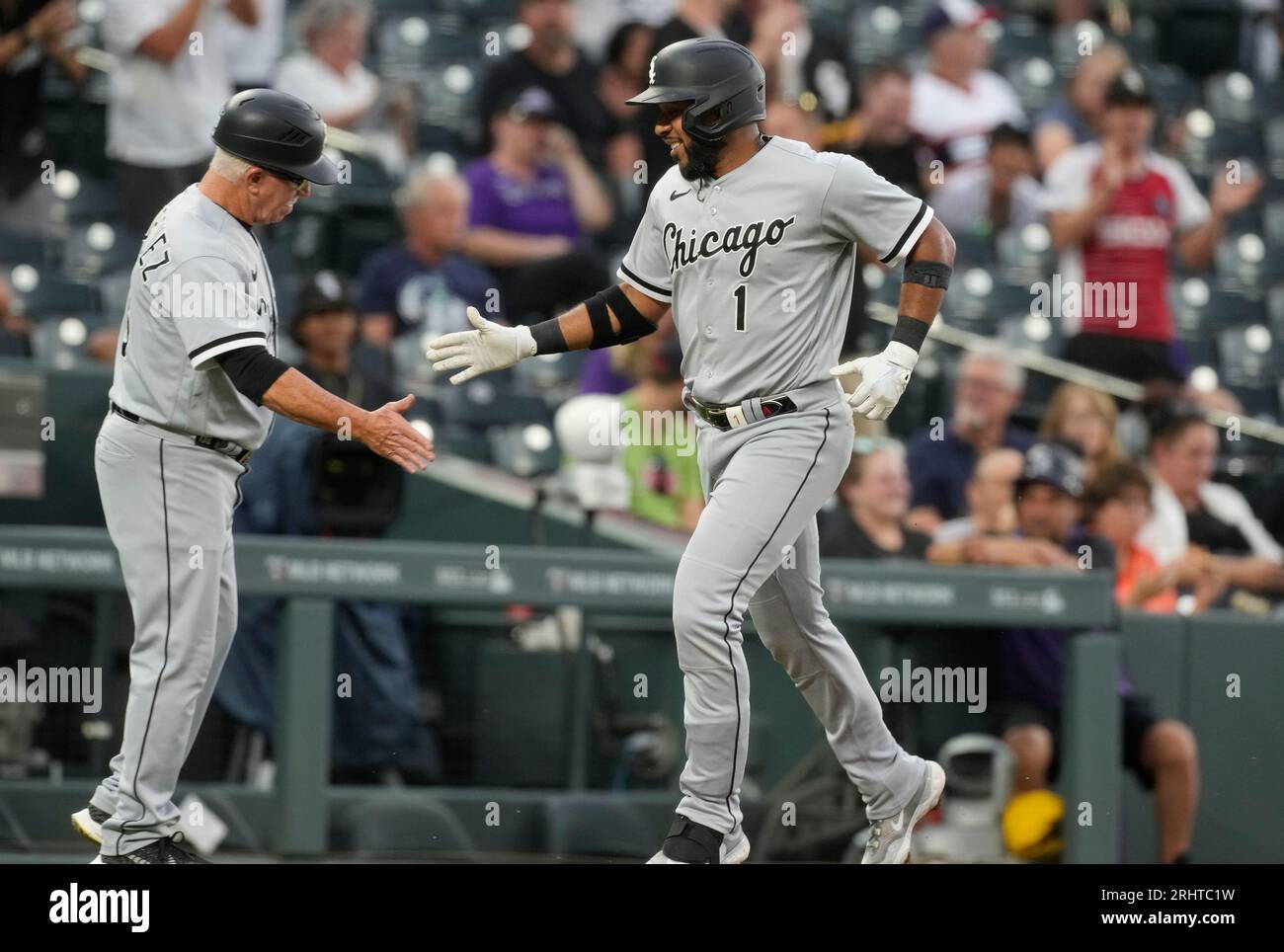 Chicago White Sox third base coach Eddie Rodriguez, left, congratulates ...