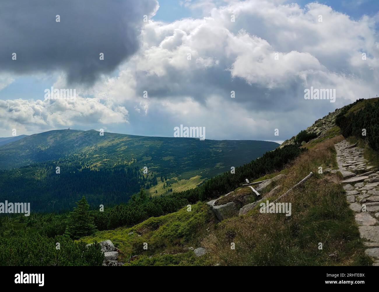 Panorama with a mountain trail. Mountain view. On the left in the ...