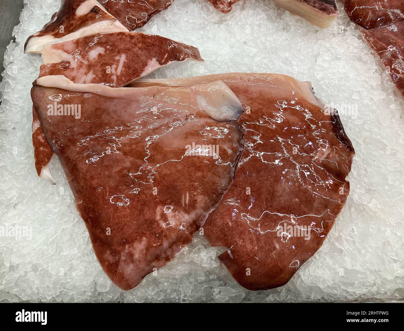 Fresh squid wing from a grocery store Stock Photo - Alamy