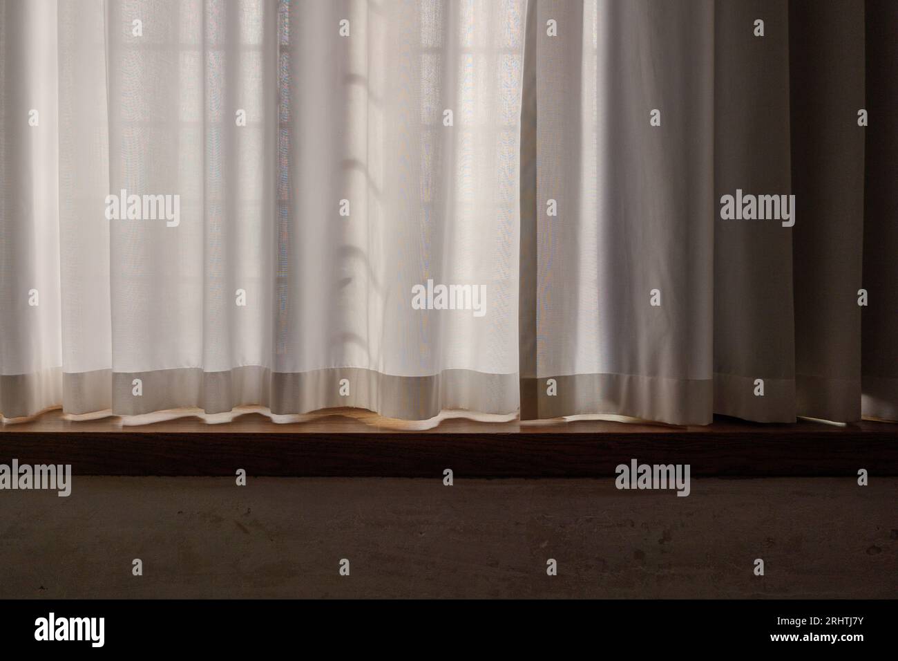 Selective focus interior view at translucent white curtain with the sun ...