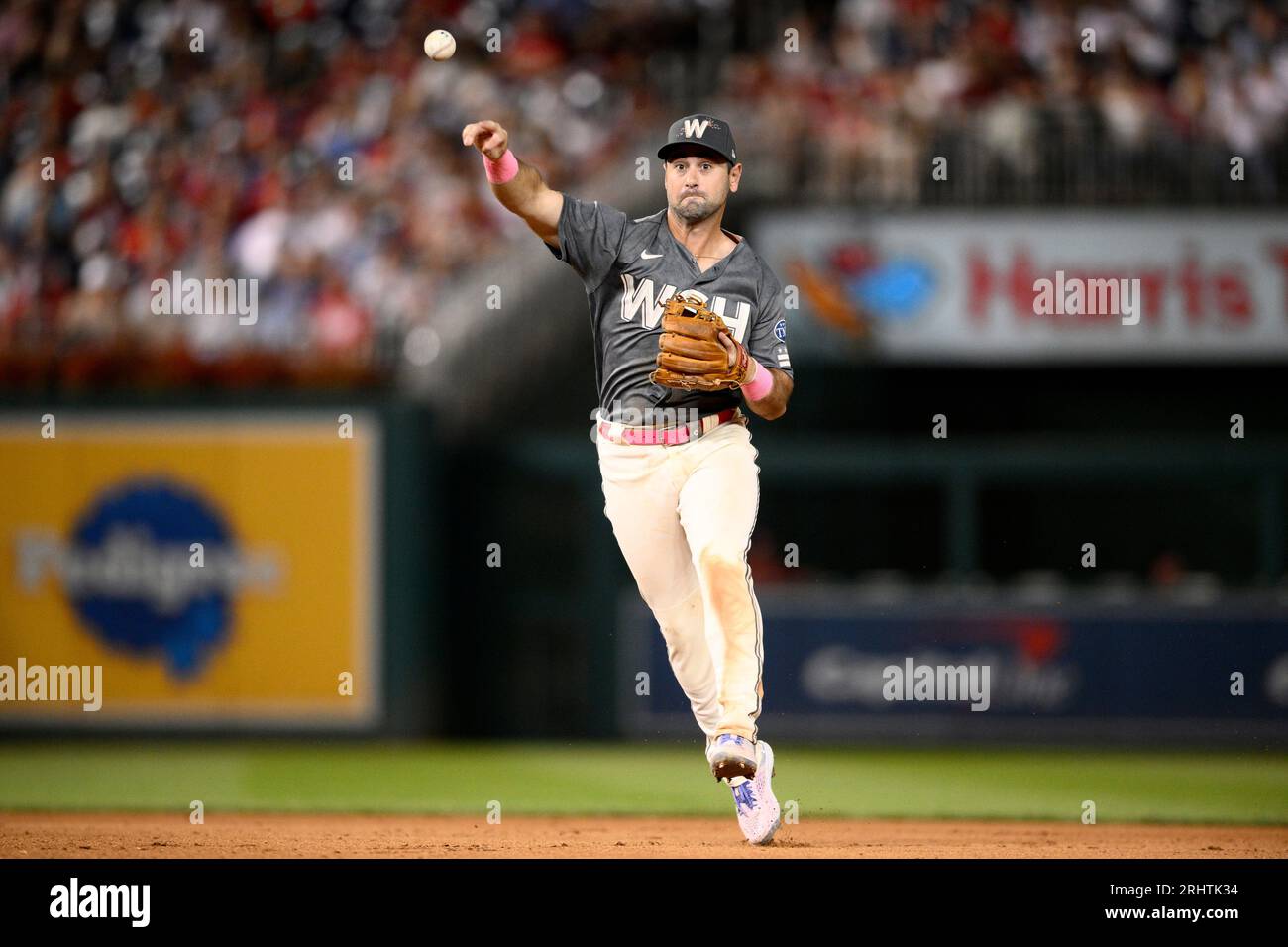 Washington Nationals second baseman Jake Alu throws to first to put out ...