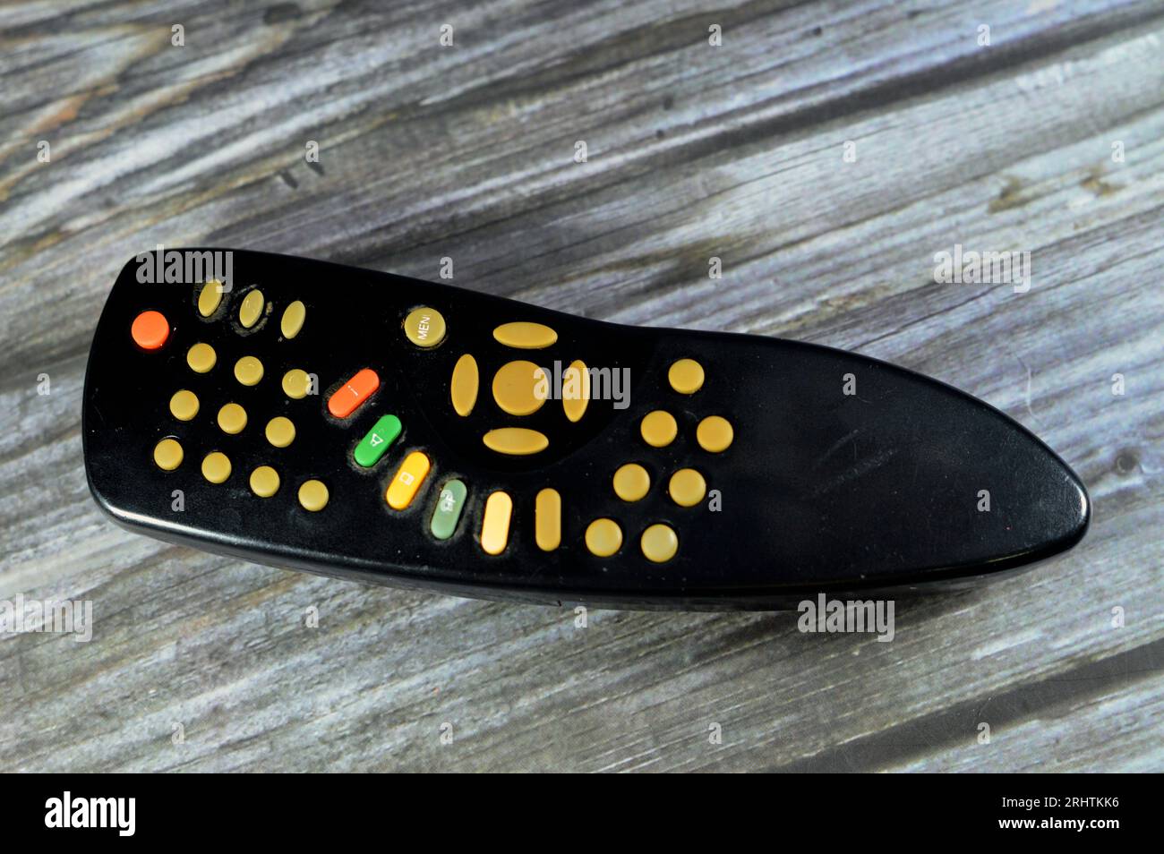 An old used remote control or a clicker, an electronic device used to ...