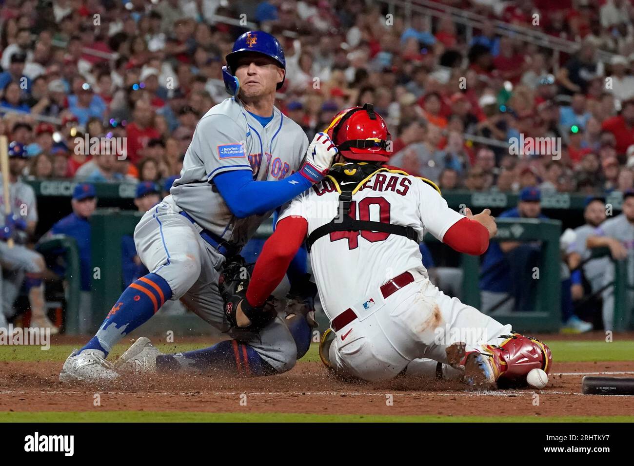 New York Mets' Brandon Nimmo, left, scores past St. Louis Cardinals ...
