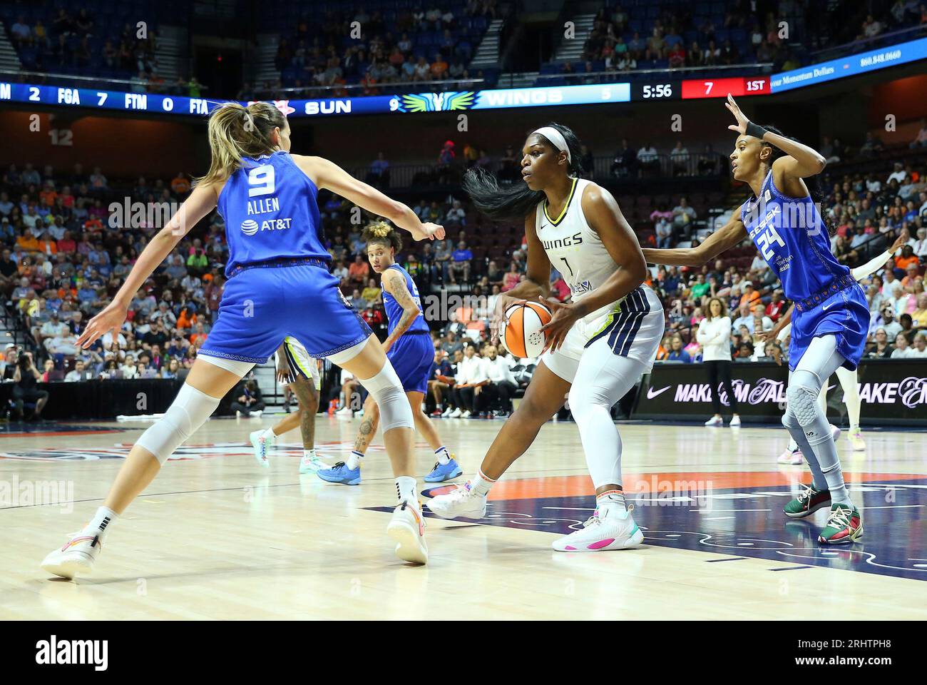 UNCASVILLE, CT - AUGUST 18: Dallas Wings center Teaira McCowan (7) doubled-teamed by Connecticut ...