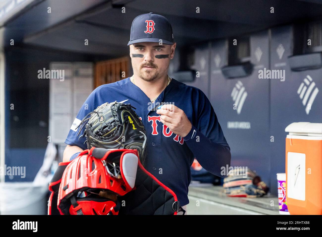 BRONX, NY - AUGUST 18: Boston Red Sox Catcher Reese McGuire (3) walks into the dugout before the ...
