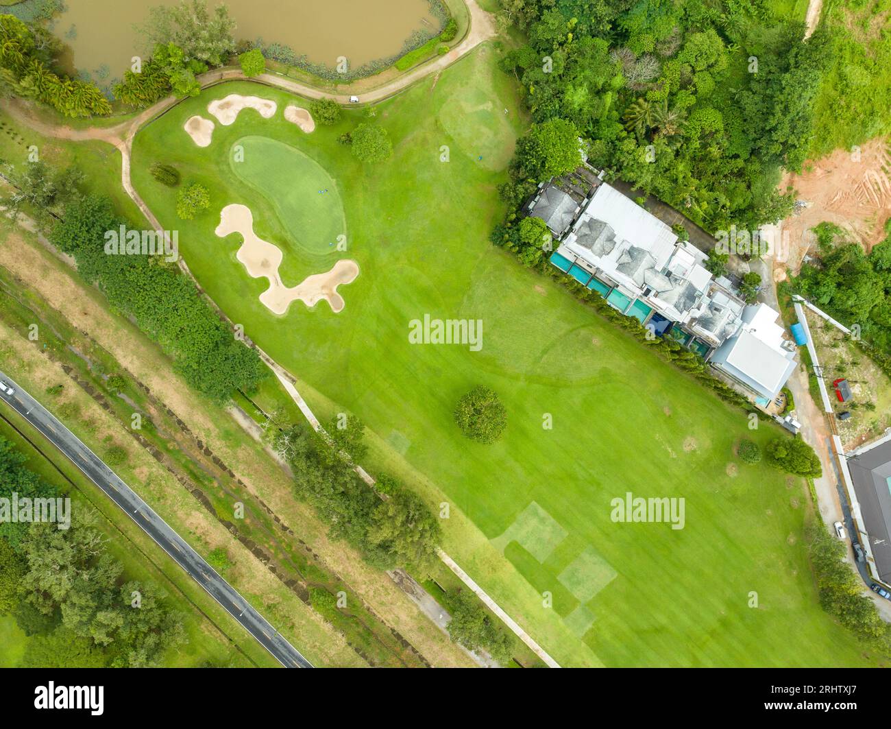 Aerial view drone shot of beautiful green golf field fairway and ...