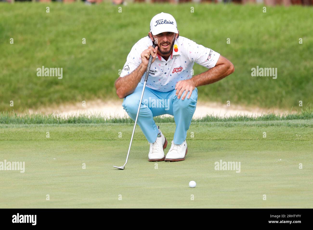 OLYMPIA FIELDS, IL - AUGUST 18: PGA golfer Max Homa lines up a putt on the 18th hole during the ...