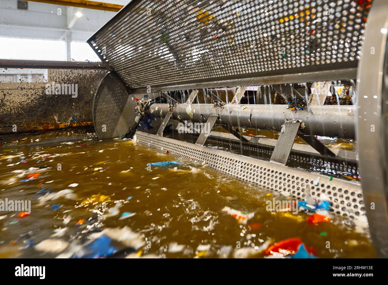 Automatic washing machine for shredded garbage plastic. Close-up of ...