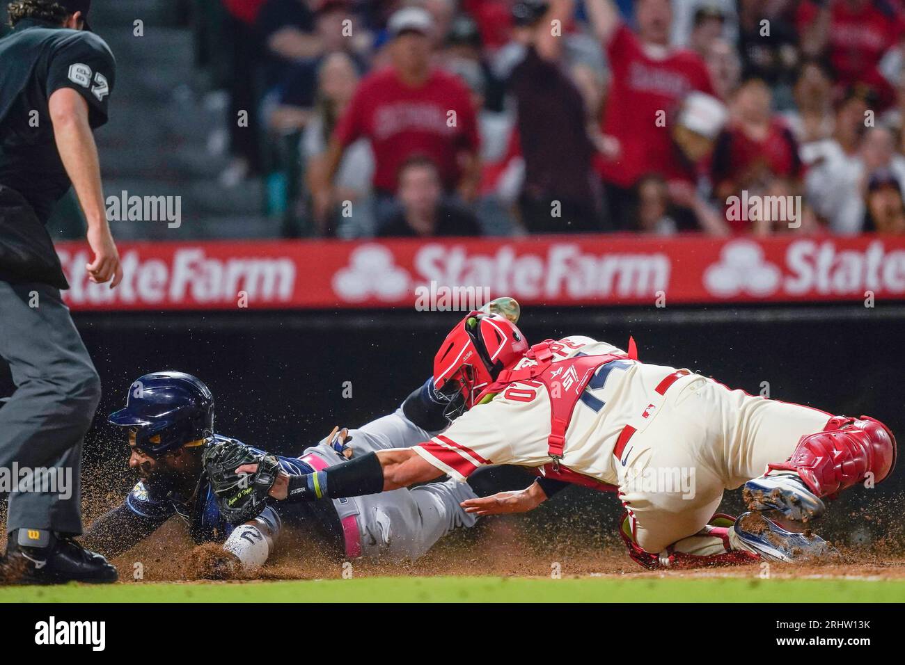 Los Angeles Angels catcher Logan O'Hoppe (14) tags out Tampa Bay Rays ...