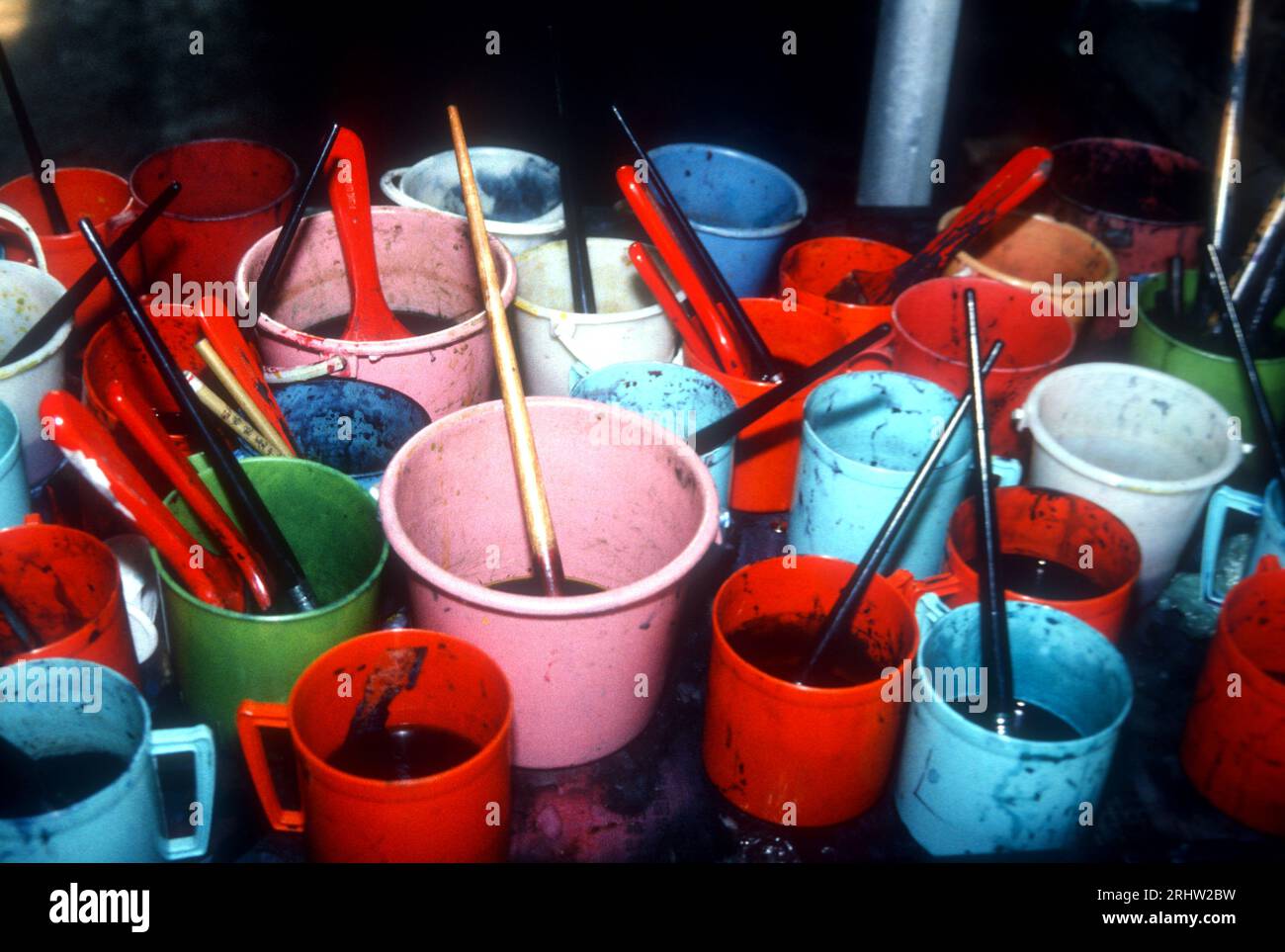 Plastic paint pots in a batik factory, Malaysia Stock Photo - Alamy