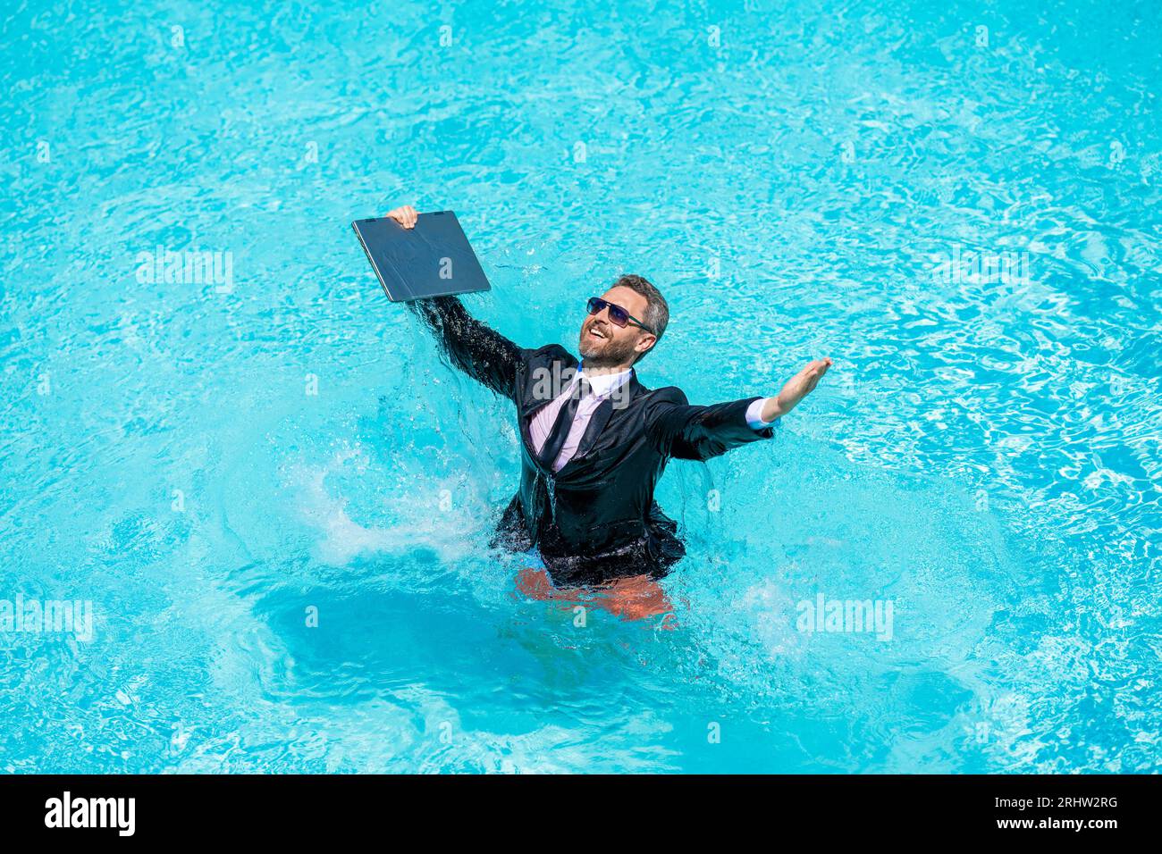 business man on summer vacation. businessman in wet suit in pool ...