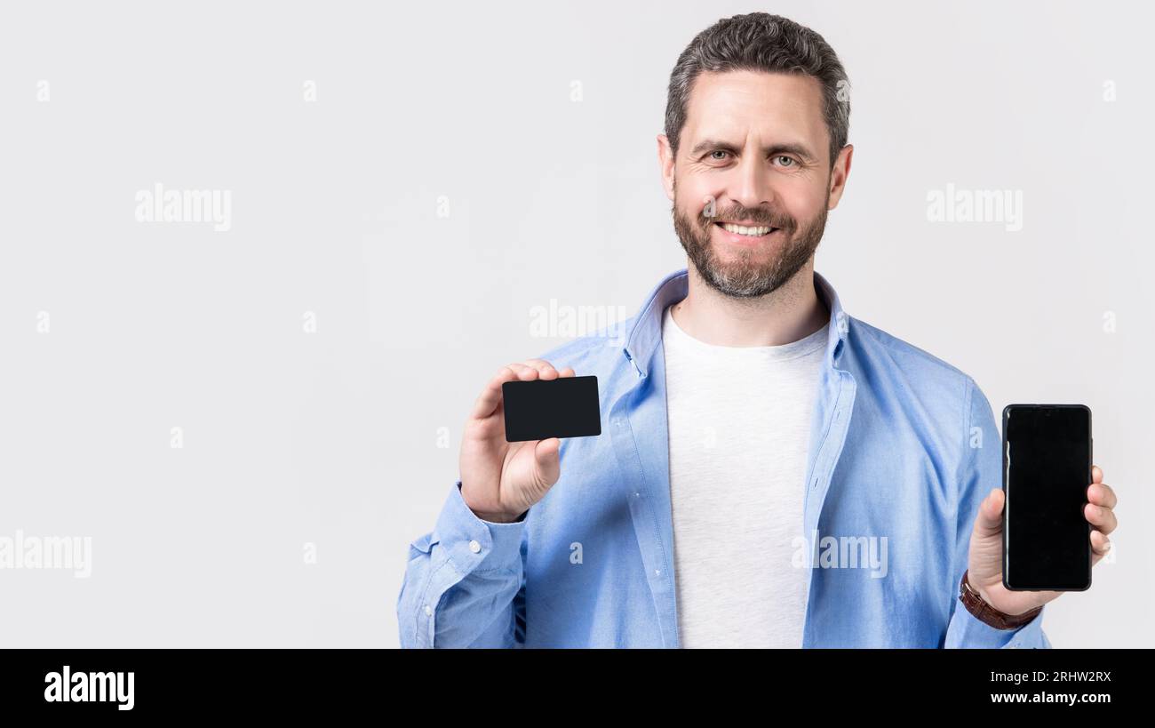 happy man paying transaction in studio. man paying transaction. photo ...