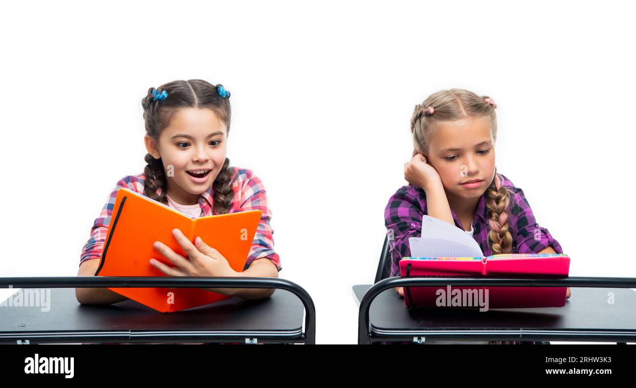 two children girls study with book at school lesson in classroom Stock ...