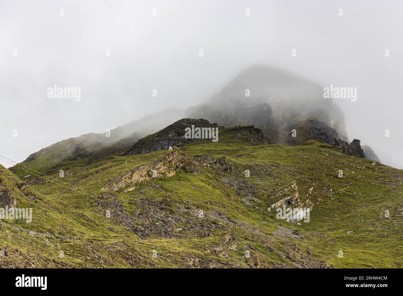 Dark Dramatic Desert Landscape with Foggy Mountains and Distant Houses ...