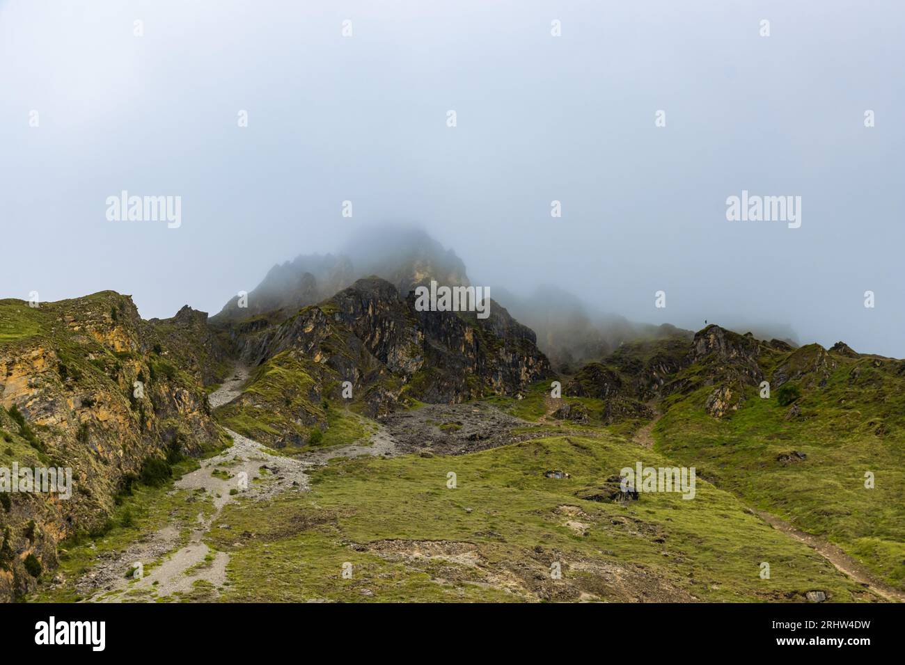 Dark Dramatic Desert Landscape with Foggy Mountains and Distant Houses ...