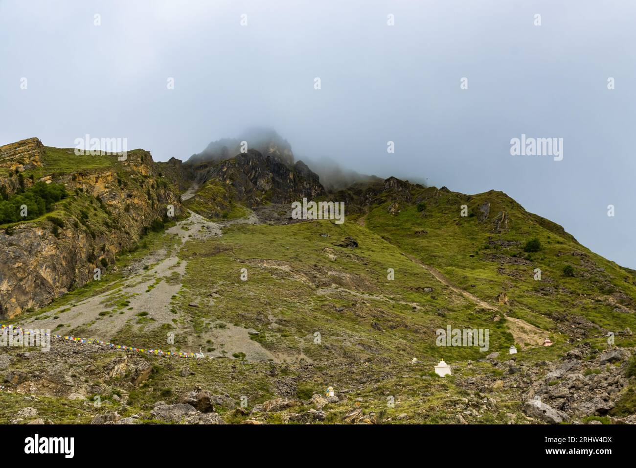 Dark Dramatic Desert Landscape with Foggy Mountains and Distant Houses ...