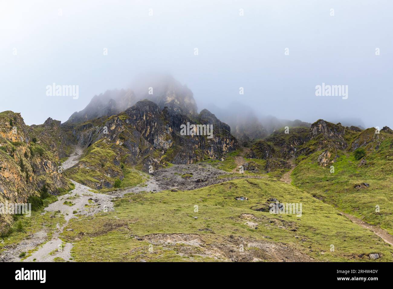 Dark Dramatic Desert Landscape with Foggy Mountains and Distant Houses ...