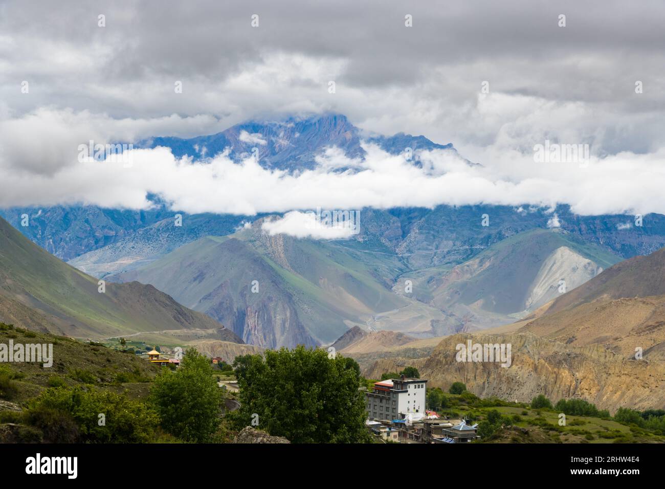 Dark Dramatic Desert Landscape with Foggy Mountains and Distant Houses ...