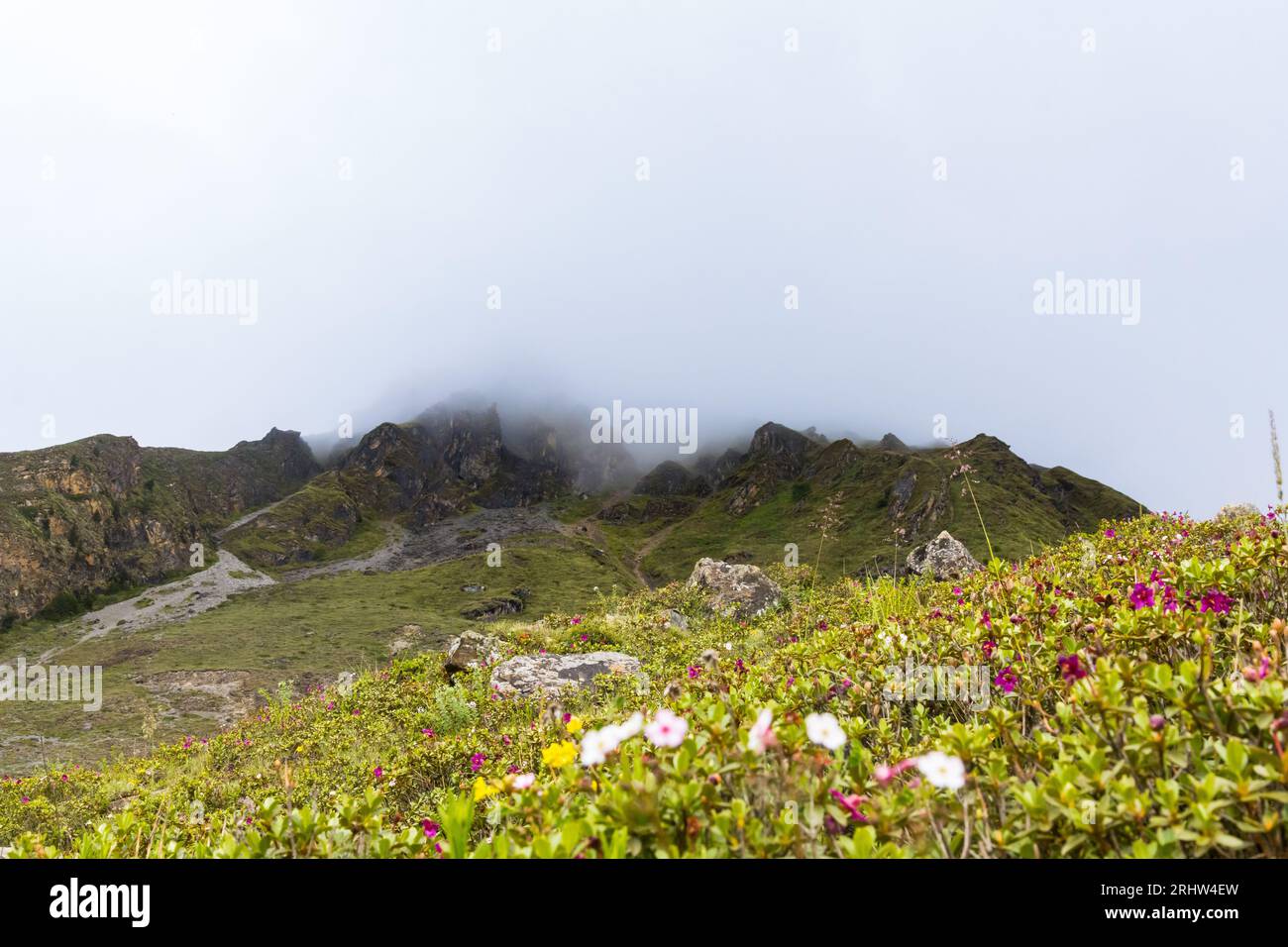 Dark Dramatic Desert Landscape with Foggy Mountains and Distant Houses ...