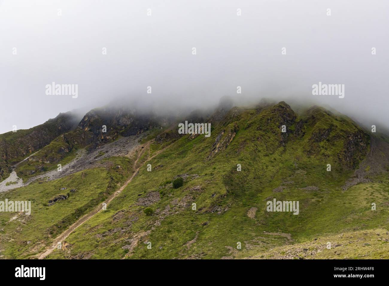 Dark Dramatic Desert Landscape with Foggy Mountains and Distant Houses ...