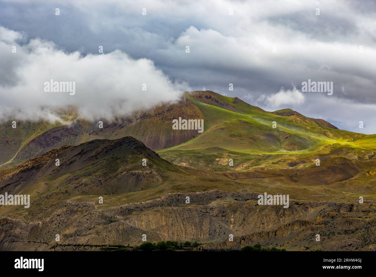 Dark Dramatic Desert Landscape with Foggy Mountains and Distant Houses ...